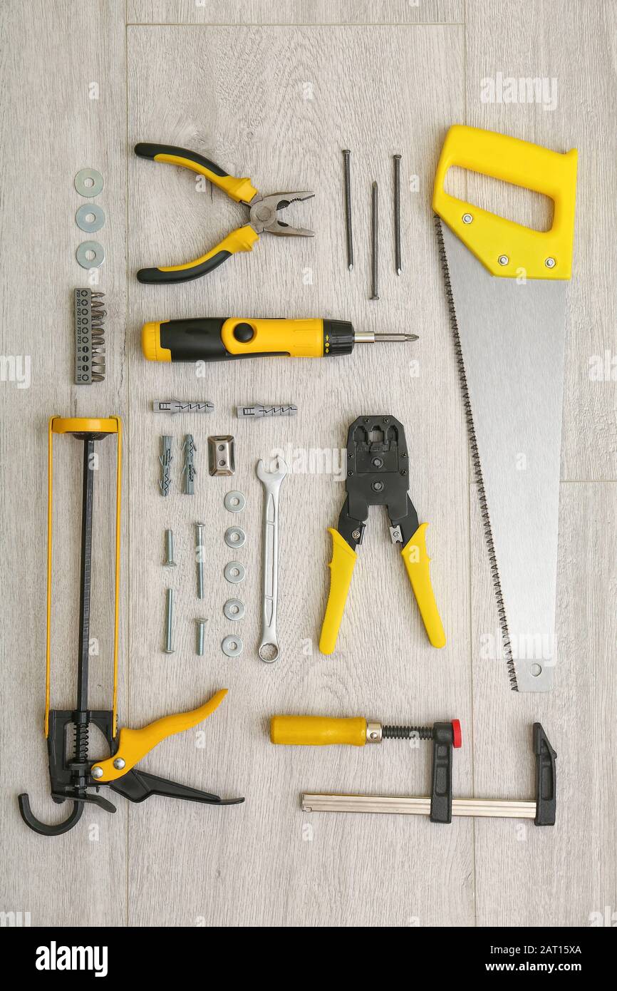 Set of tools for furniture assembling on wooden background Stock Photo ...