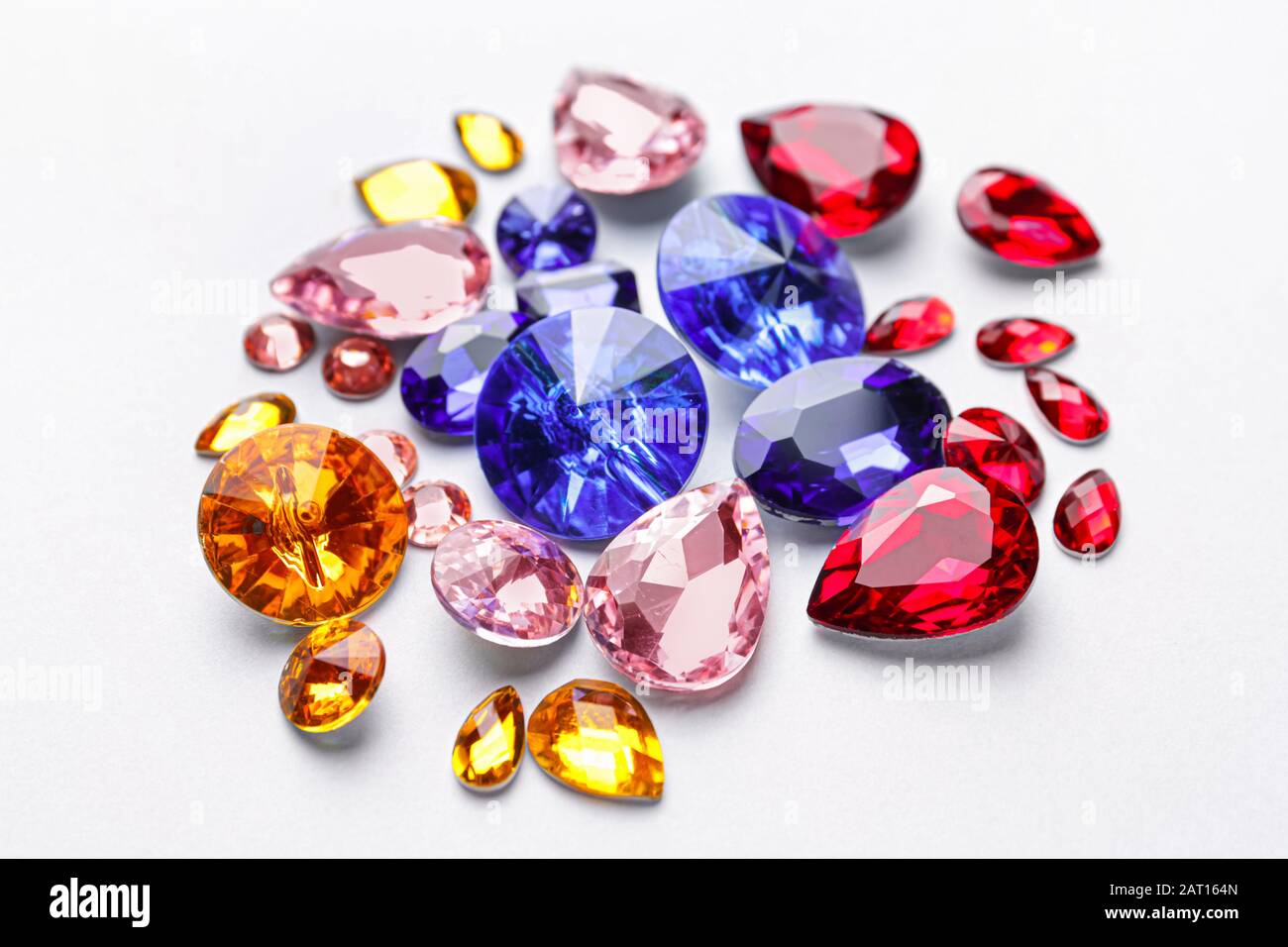 Different precious stones for jewellery on light background Stock Photo ...