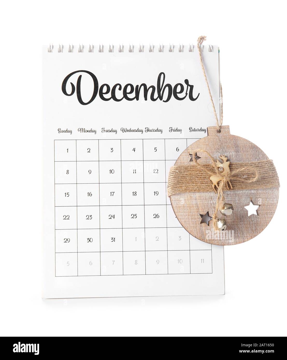 Calendar with page of December and Christmas decor on white background ...