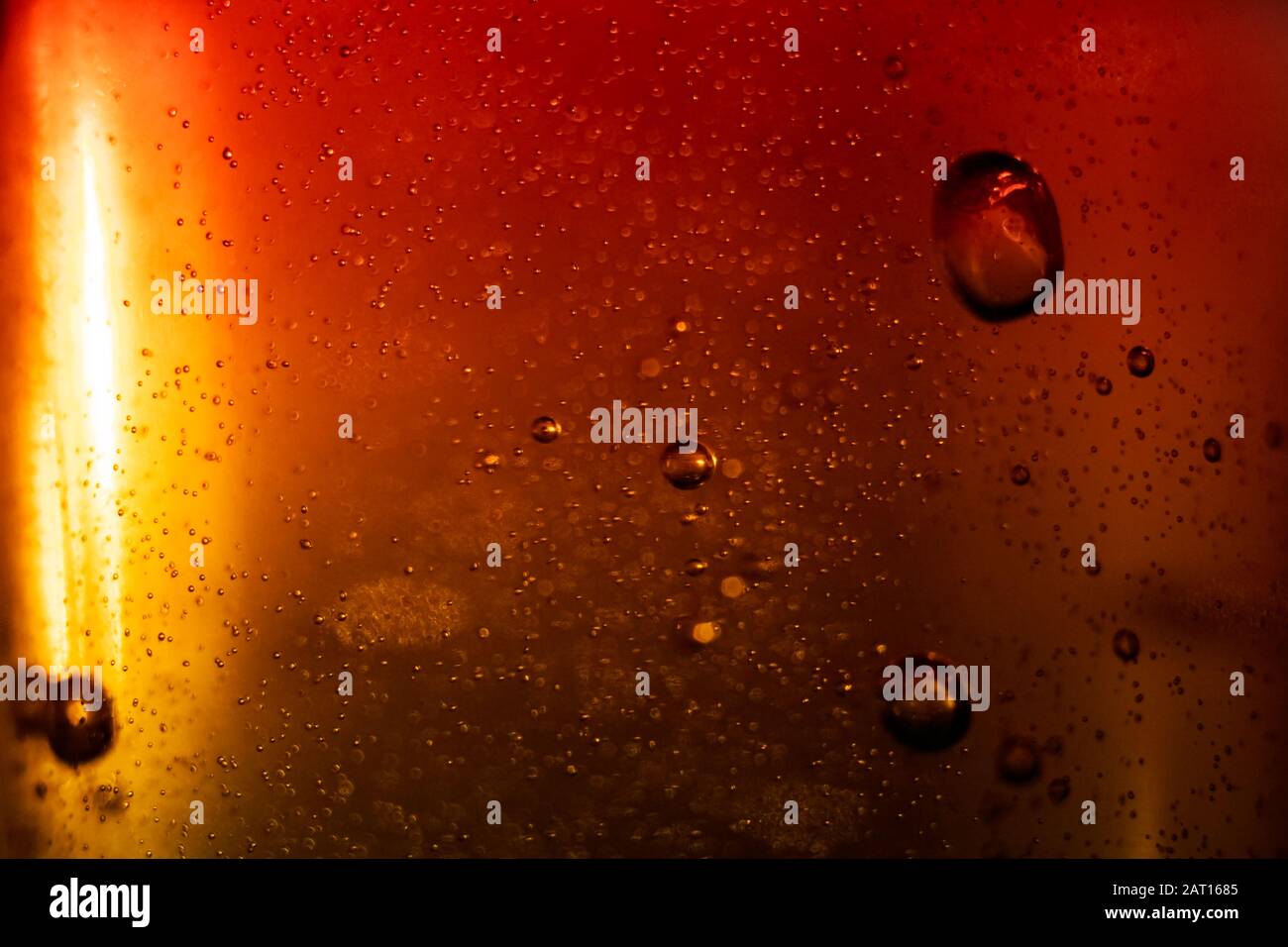 Bubbles in red water on a gray background Stock Photo - Alamy