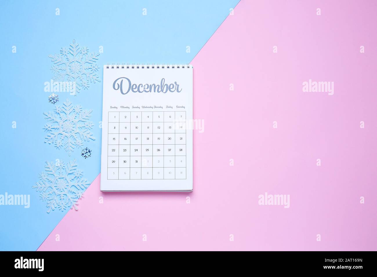 Calendar with page of December on color background Stock Photo - Alamy
