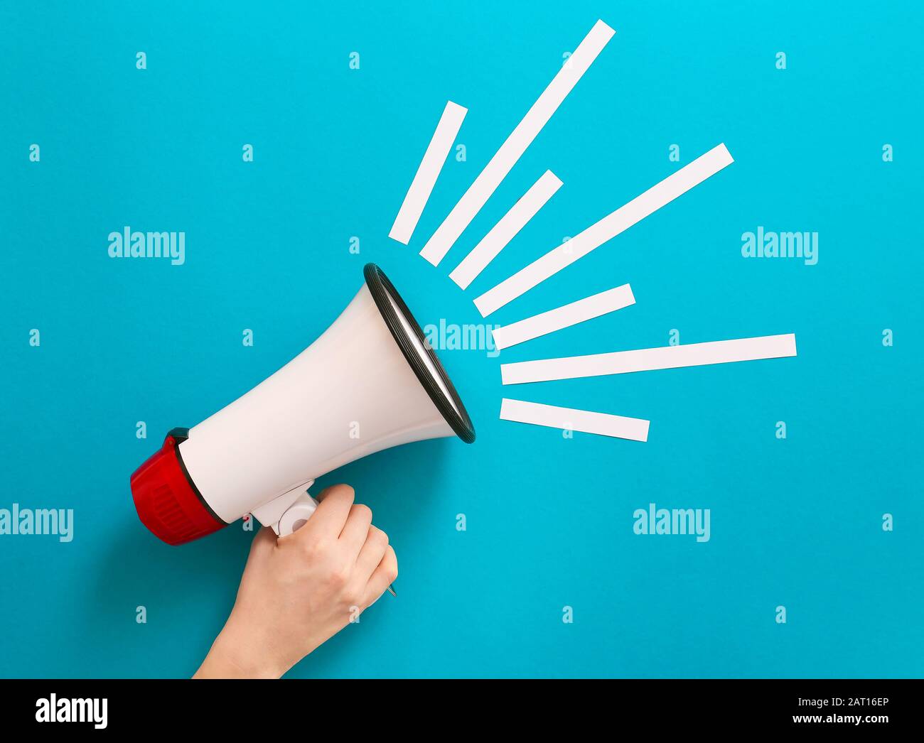 Female hand with megaphone on color background Stock Photo - Alamy