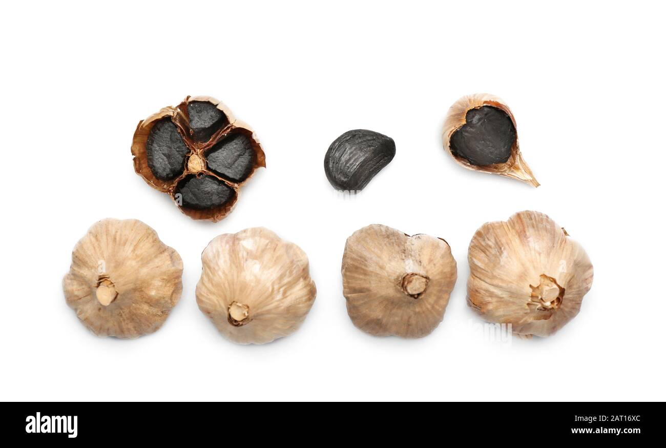 Black garlic on white background Stock Photo - Alamy