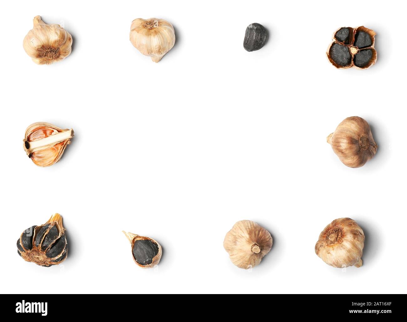 Frame made of black garlic on white background Stock Photo - Alamy