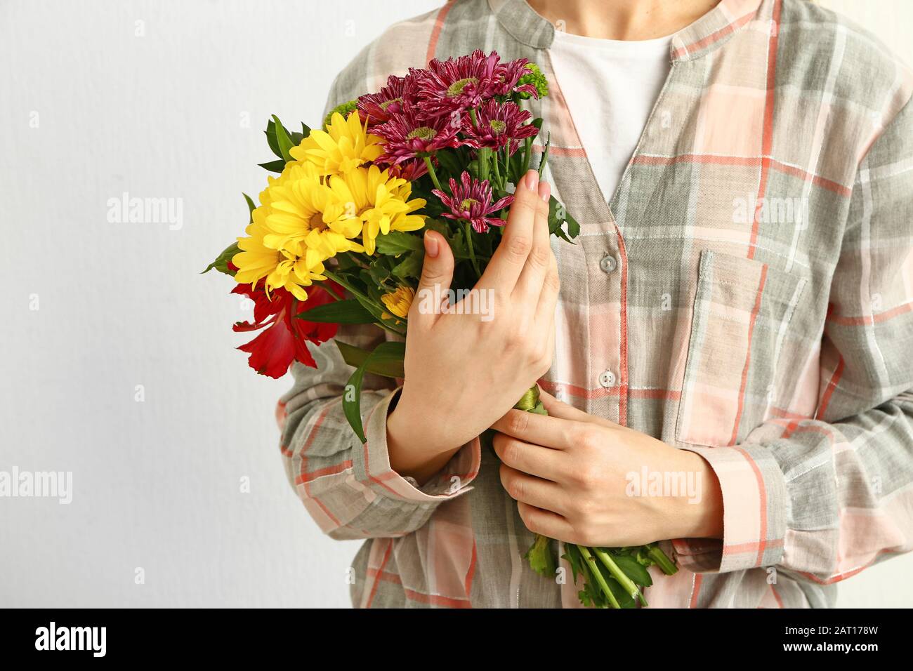 Florist with beautiful bouquet on white background Stock Photo - Alamy