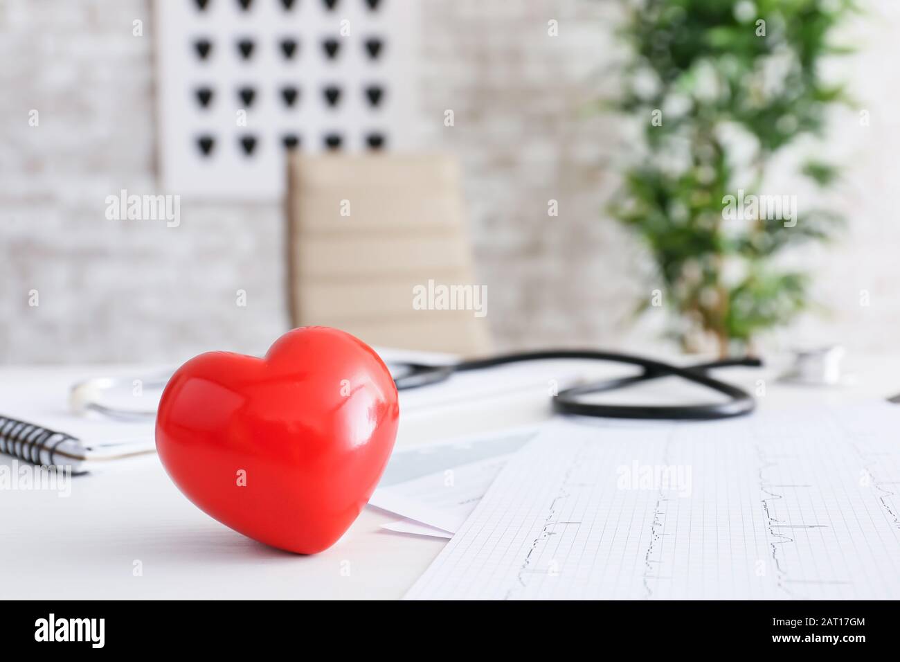 Cardiogram and heart on doctor's table. Cardiology concept Stock Photo ...