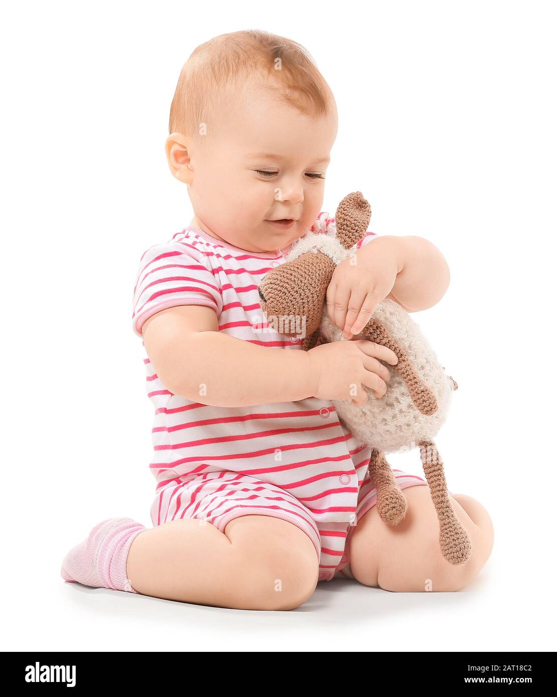 Cute little baby with toy on white background Stock Photo - Alamy