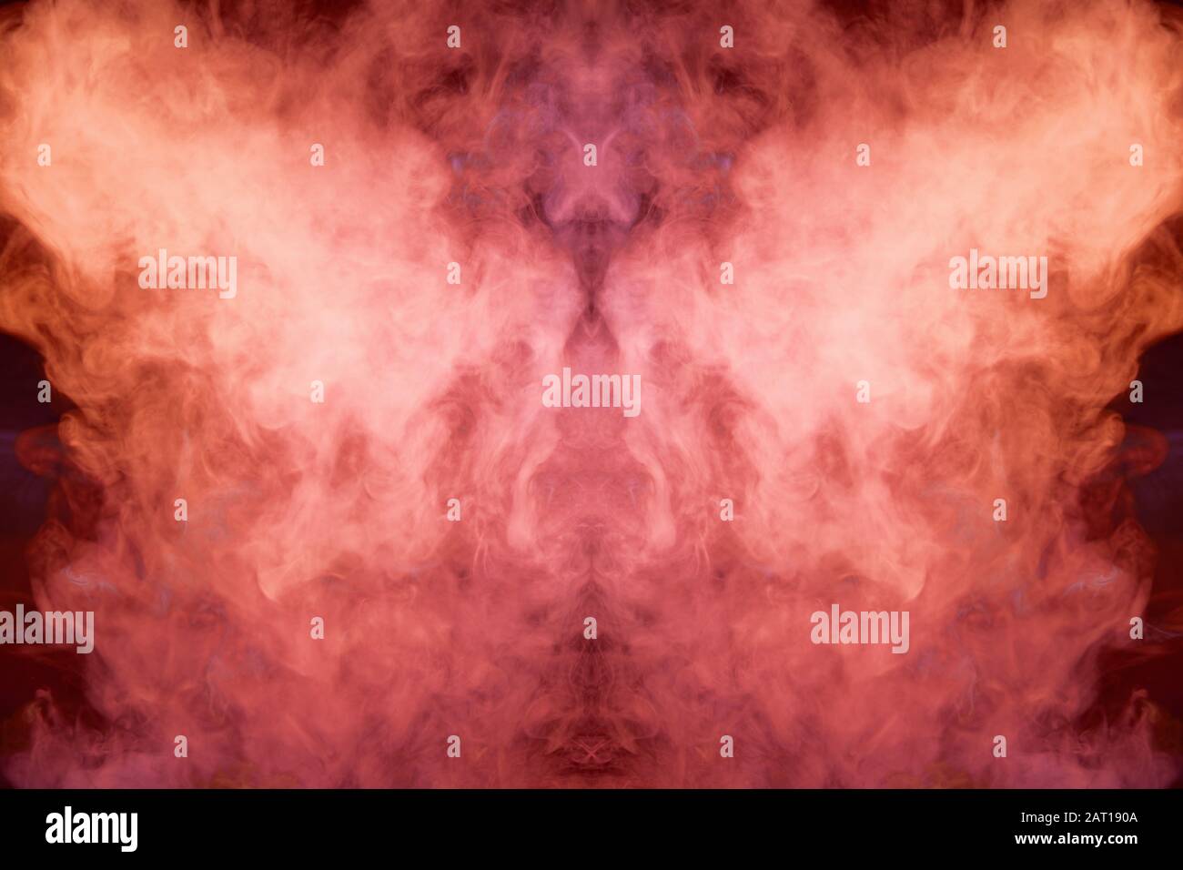 Smoke of pattern pink and red in the form of horror monster on a dark ...