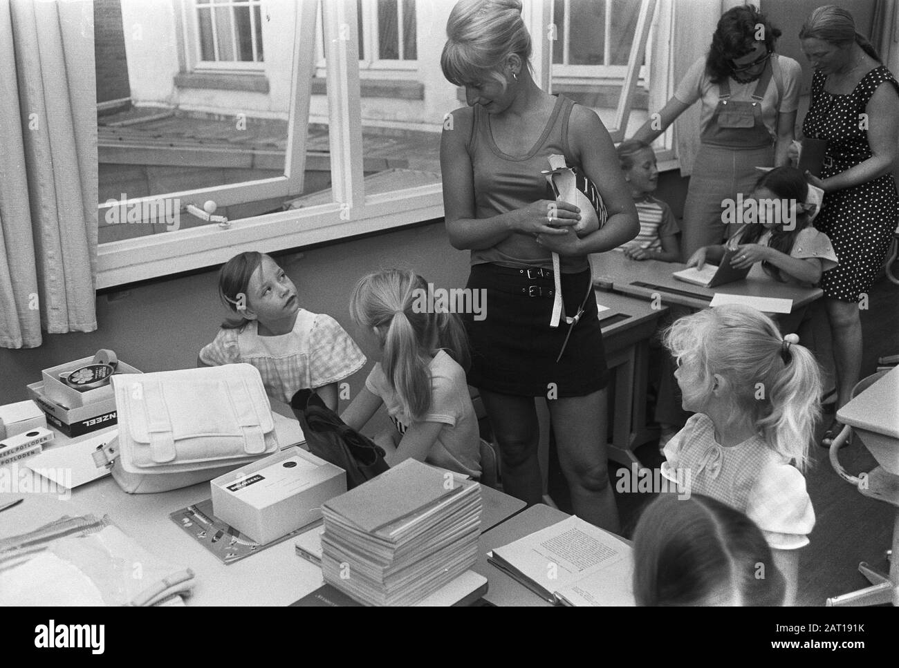 First day of school, in class with parents Date: August 13, 1973 ...