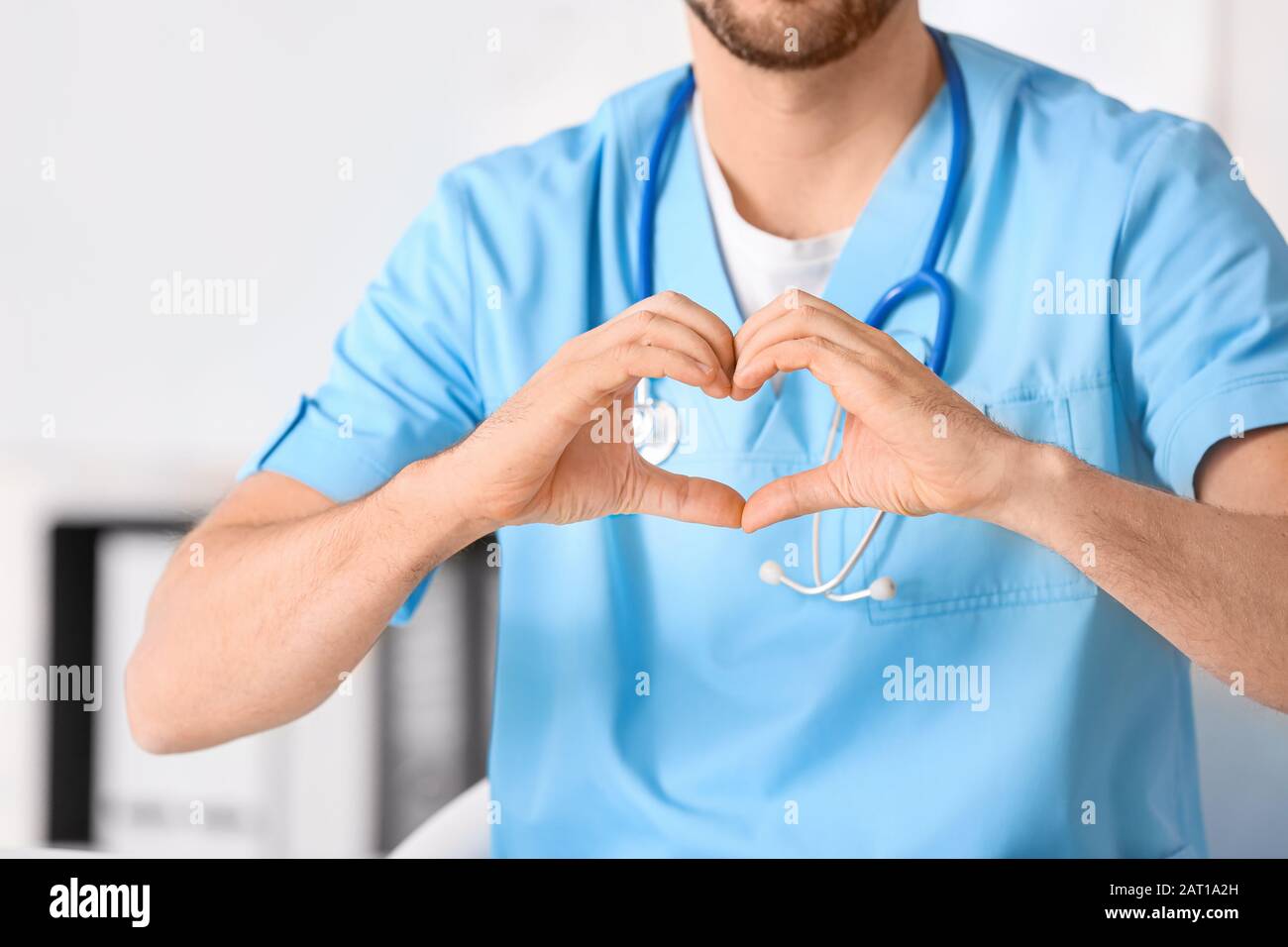 Cardiologist making heart hands hi-res stock photography and images - Alamy