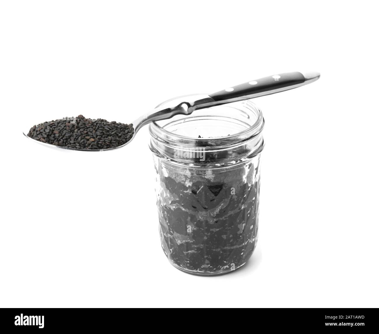 Jar of tasty tahini on white background Stock Photo - Alamy