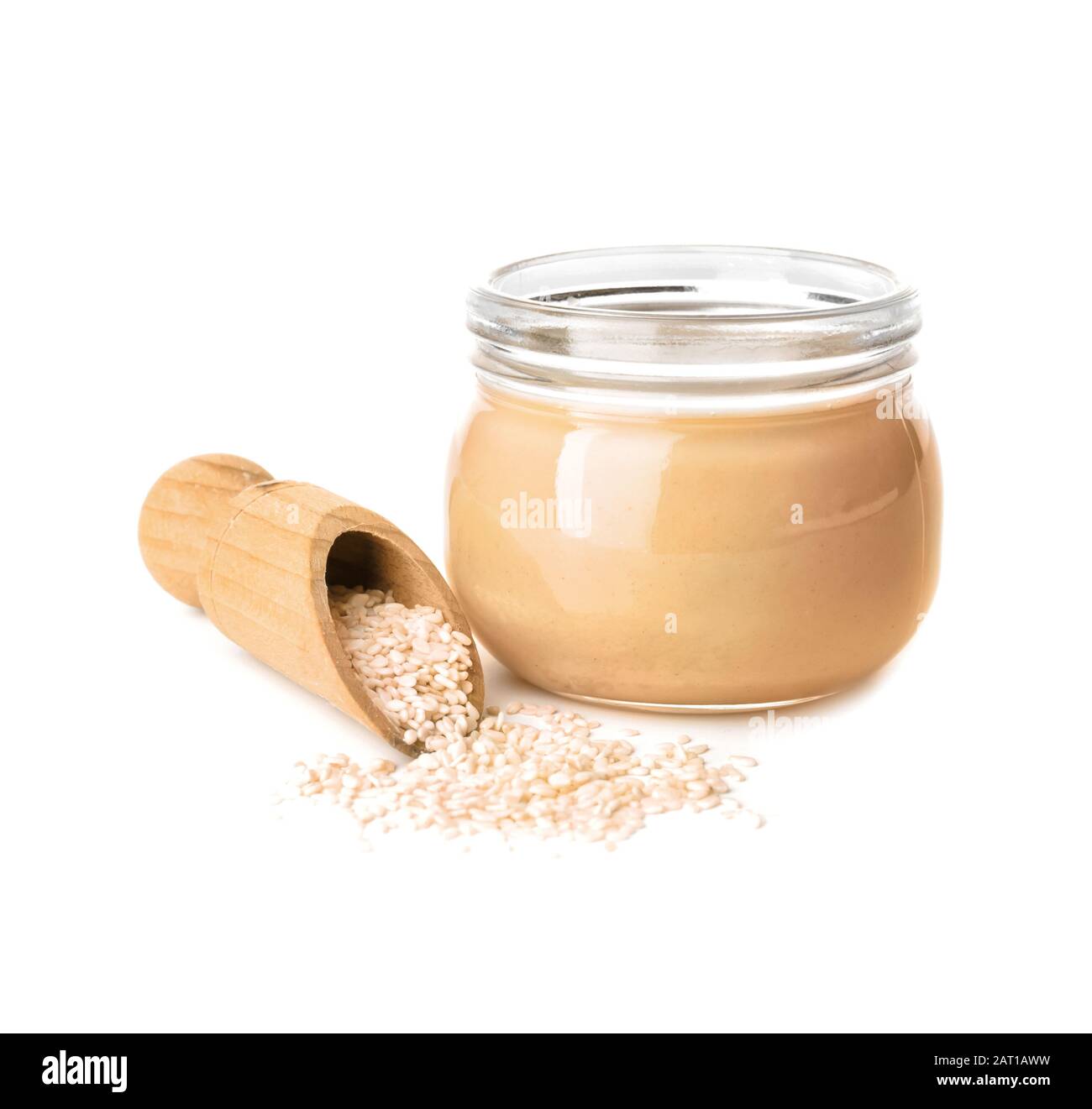 Jar of tasty tahini on white background Stock Photo - Alamy