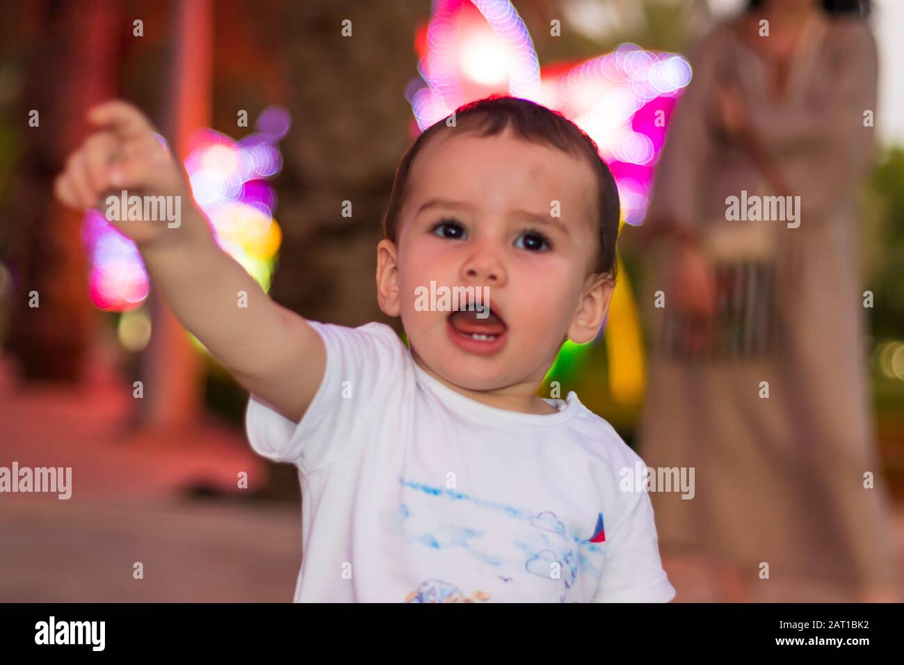 a cute little girl in the Dubai Glow Garden at the evening Stock Photo ...