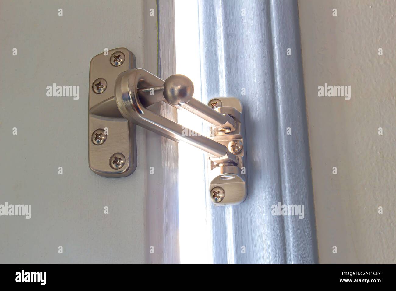 Open Door Guard with a Swing Loop Keeper. Door lock Stock Photo - Alamy