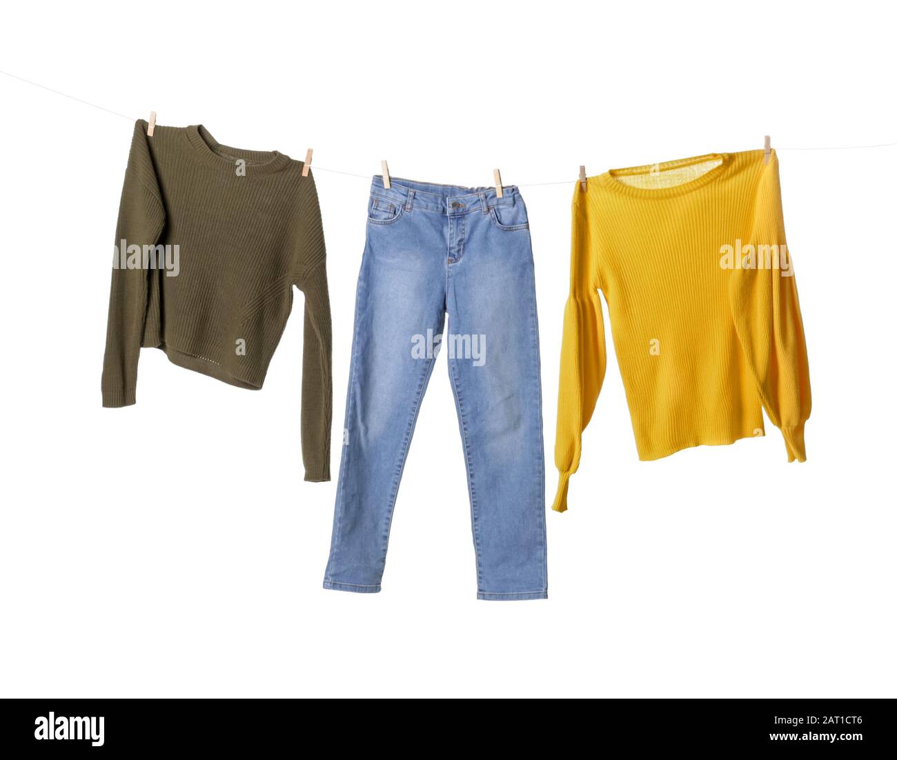 Clean clothes hanging on rope against white background Stock Photo - Alamy