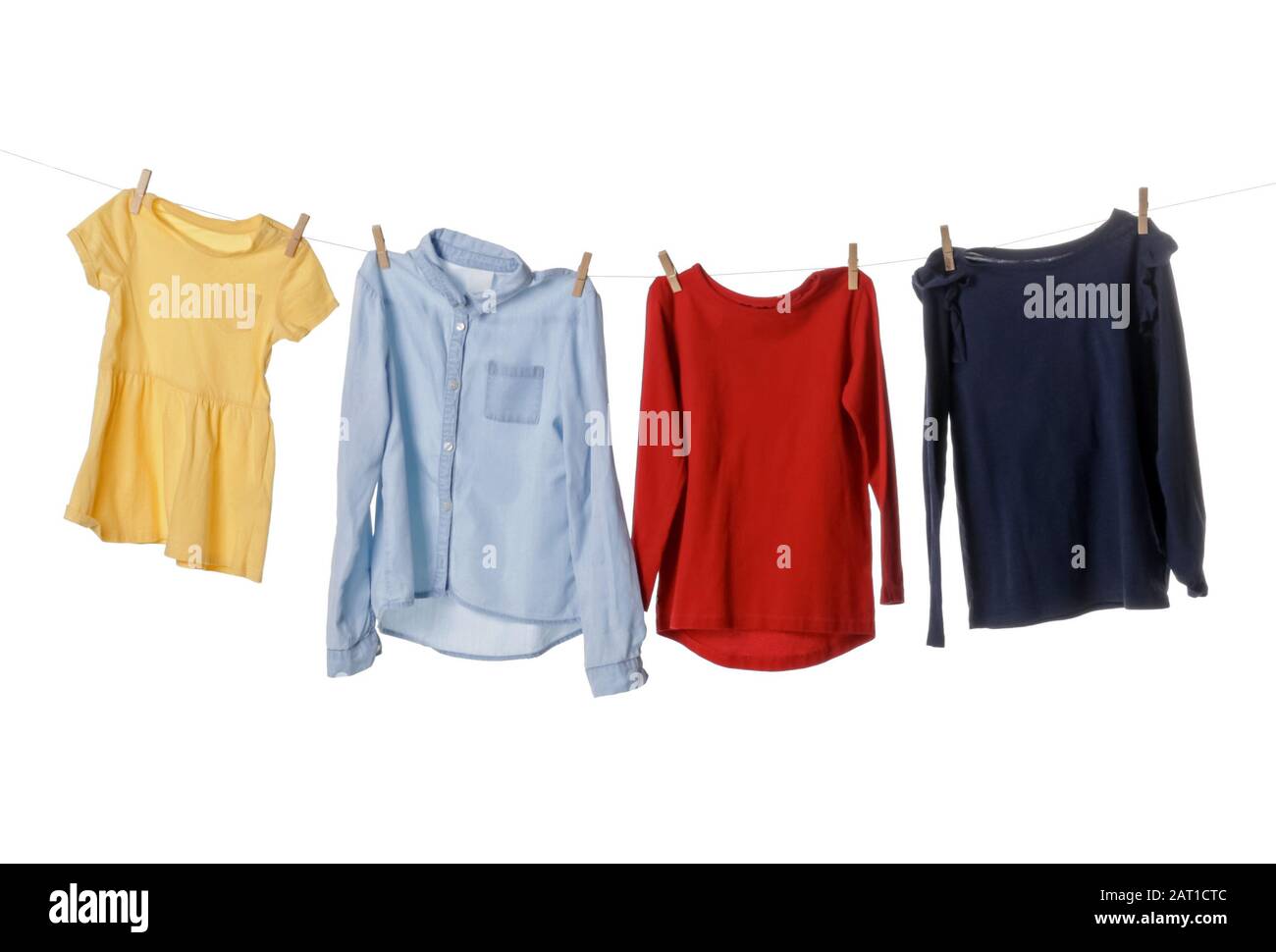 Clean clothes hanging on rope against white background Stock Photo - Alamy