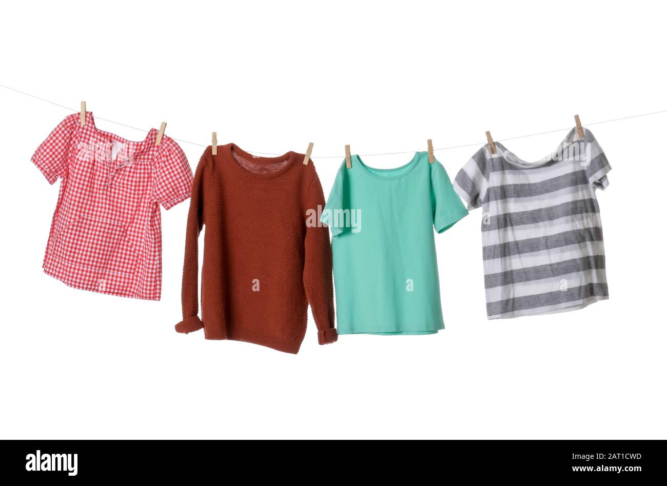 Clean clothes hanging on rope against white background Stock Photo - Alamy