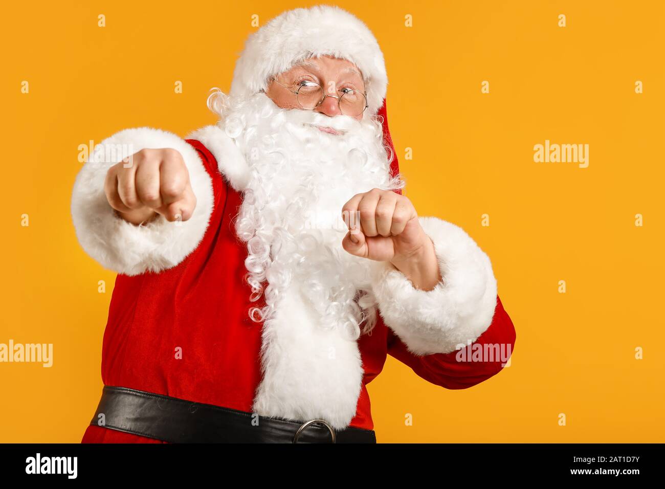 Funny drunk aggressive Santa Claus on color background Stock Photo - Alamy