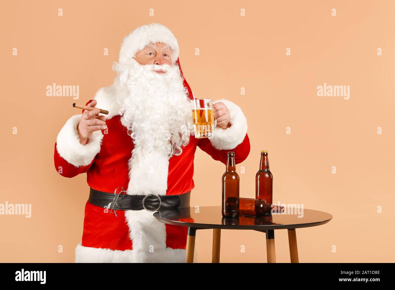 Funny drunk Santa Claus with alcohol and cigar on color background ...