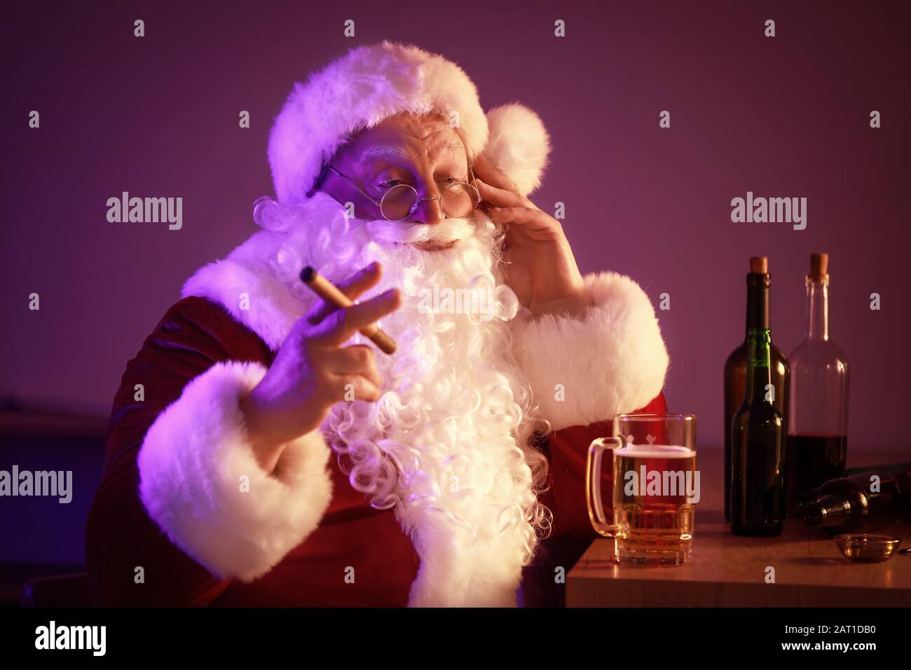 Funny drunk Santa Claus with cigar in pub Stock Photo - Alamy
