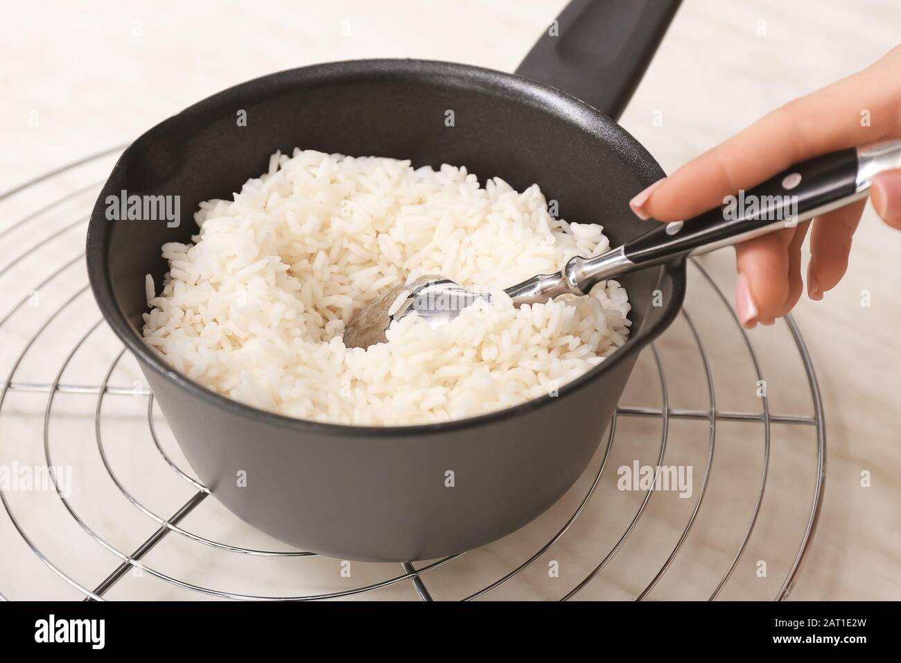 Rice boiling in saucepan hi-res stock photography and images - Alamy
