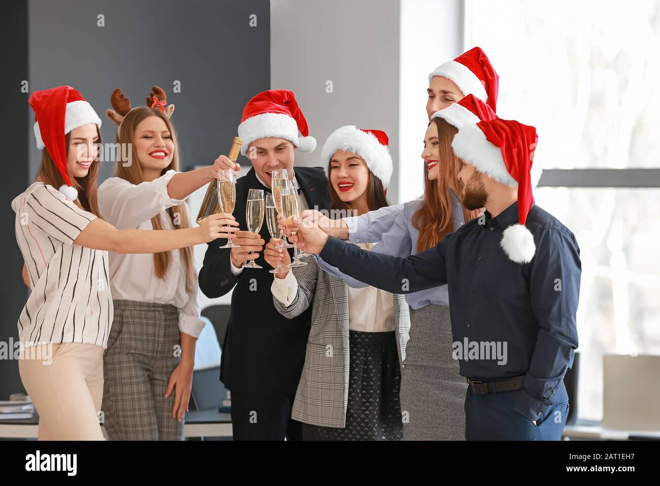 Colleagues at New Year party in office Stock Photo - Alamy
