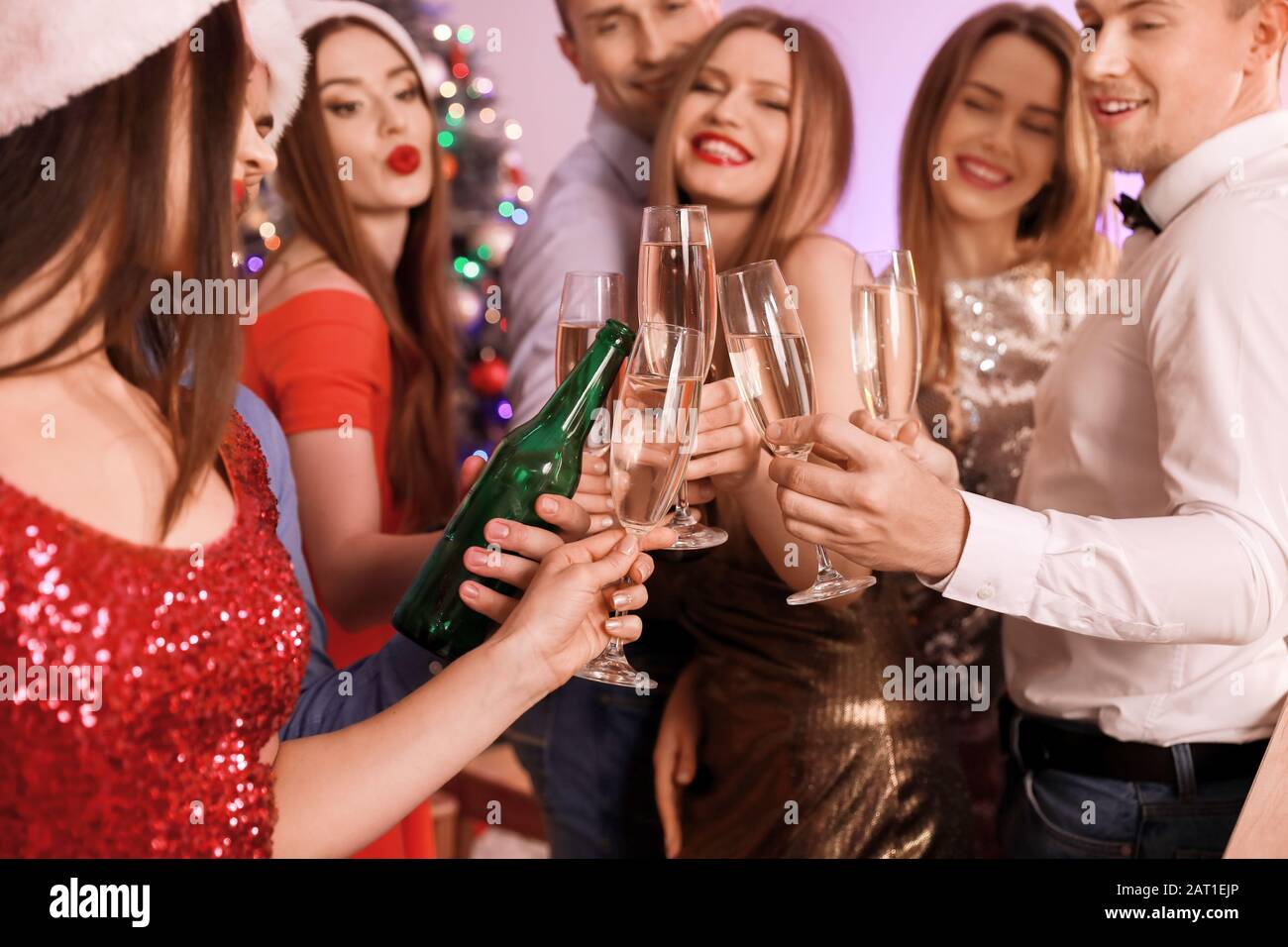 Friends drinking alcohol at New Year party Stock Photo - Alamy