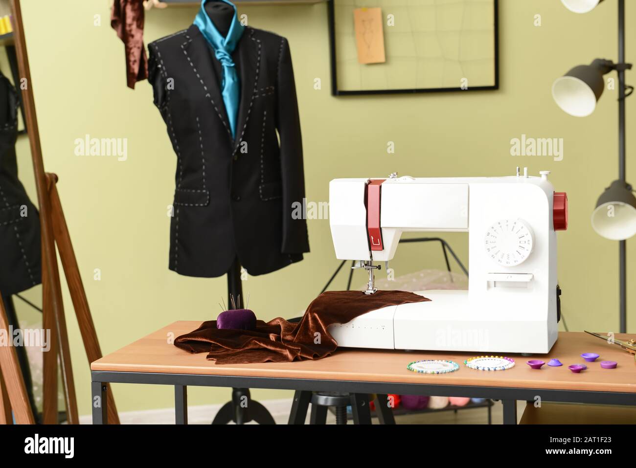 Interior of modern atelier with tailor's workplace Stock Photo - Alamy