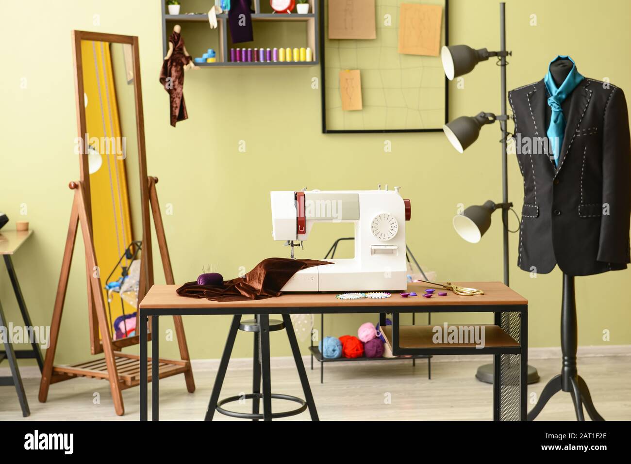 Interior of modern atelier with tailor's workplace Stock Photo - Alamy