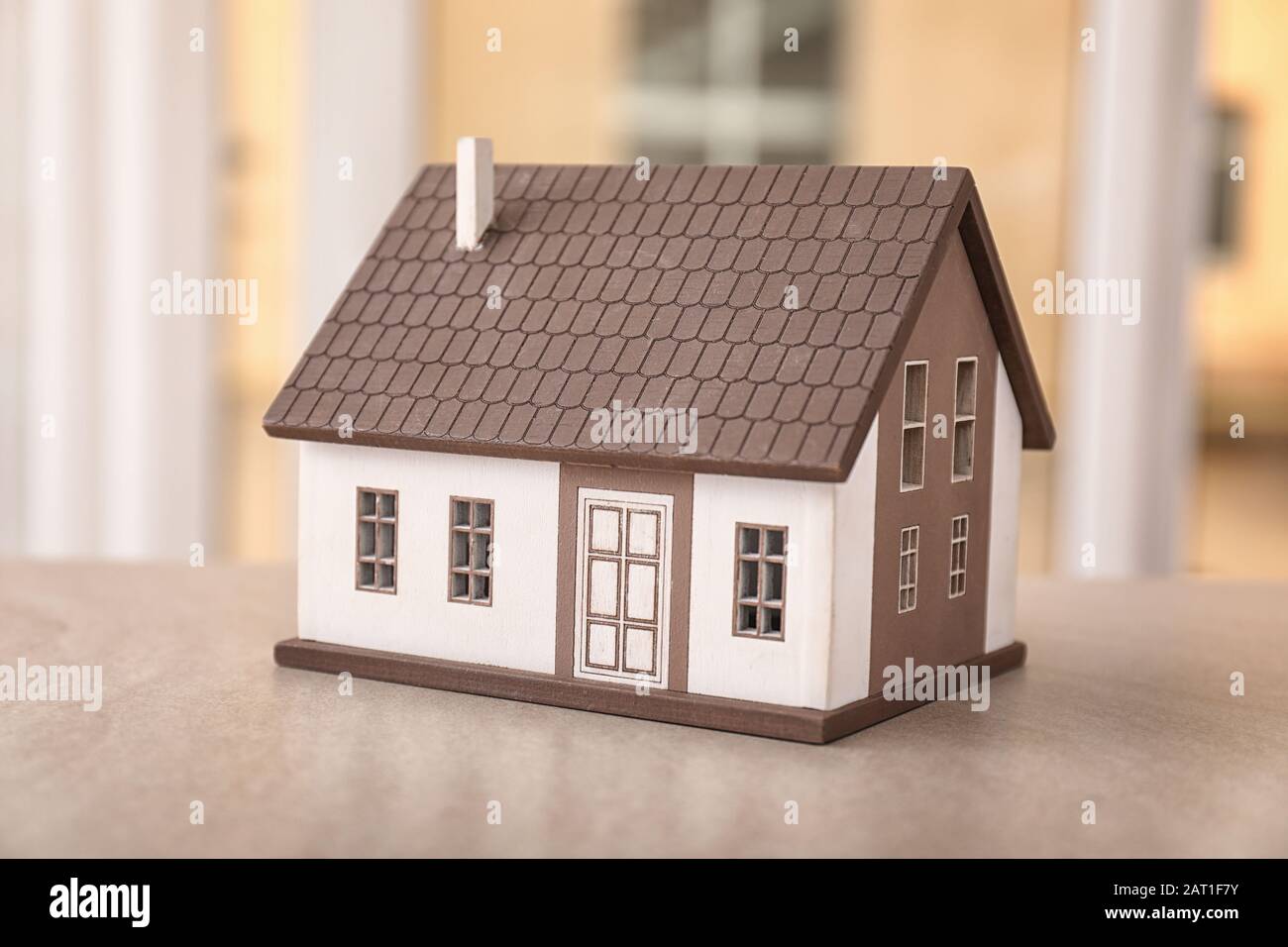 Model of house on table indoors Stock Photo - Alamy