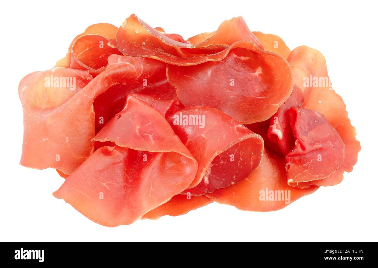 Traditional Italian Bresaola dry cured beef slices isolated on a white ...