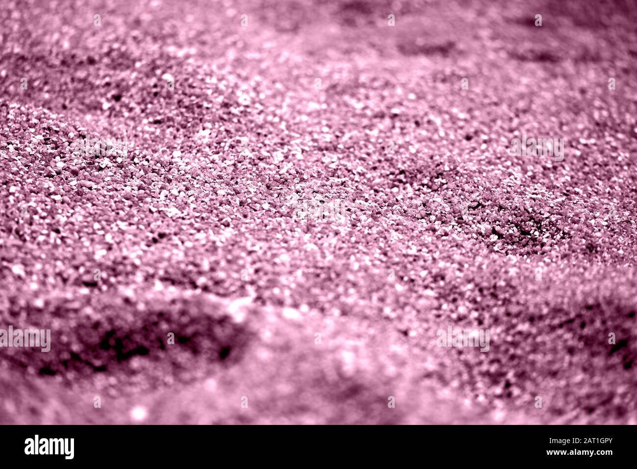 Coastal sand texture close-up. Natural background pink color toned ...