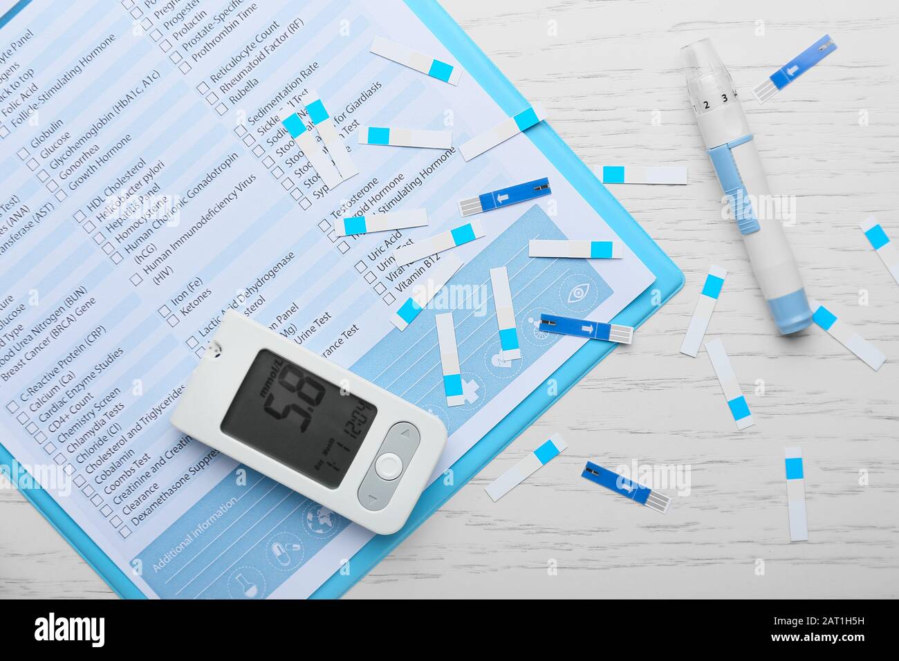 Laboratory test, glucometer and lancet pen on table. Diabetes concept ...