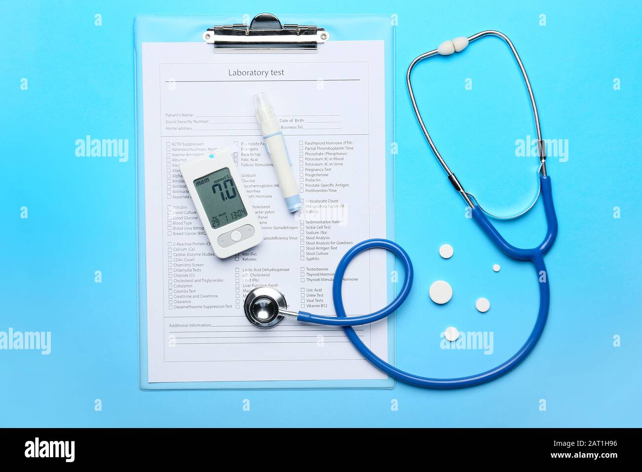 Laboratory test, glucometer, stethoscope and lancet pen on color ...