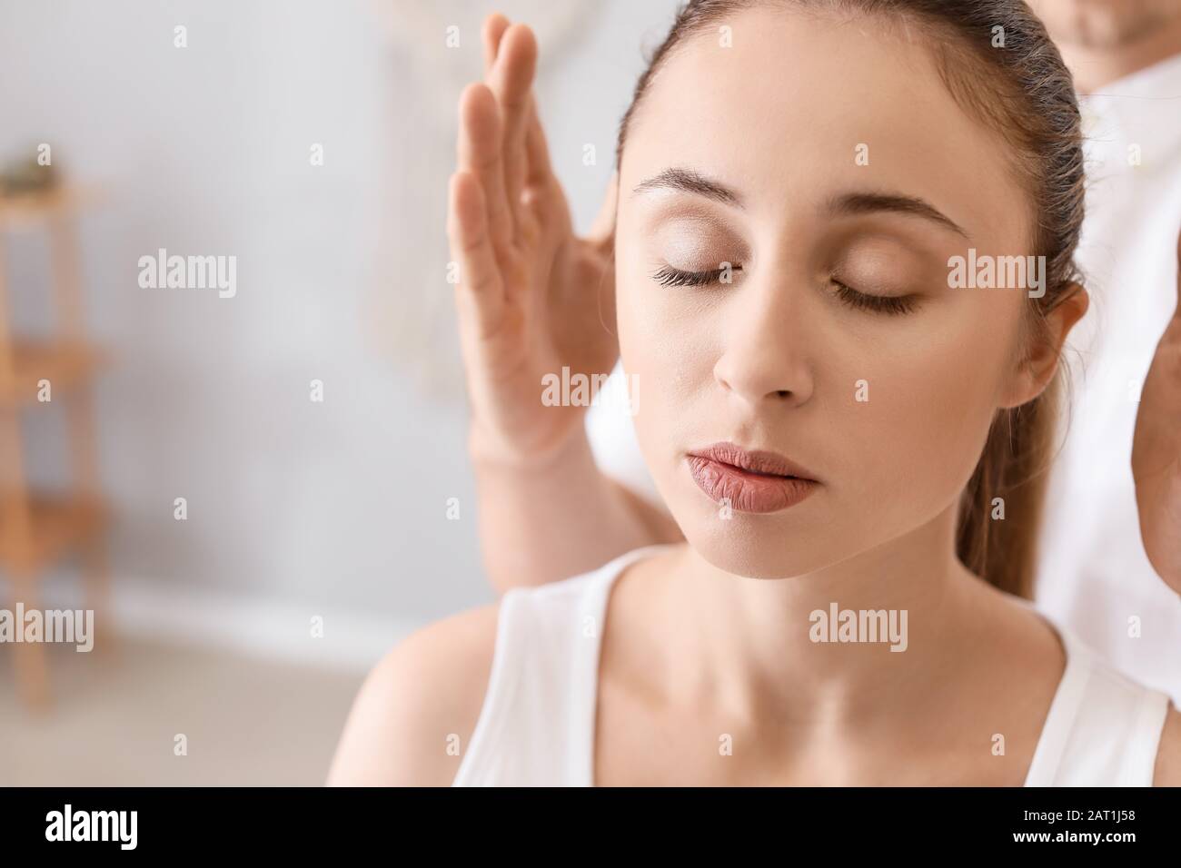 Reiki master working with patient Stock Photo - Alamy