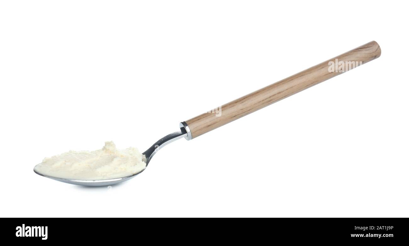 Spoon with tasty cream cheese on white background Stock Photo - Alamy