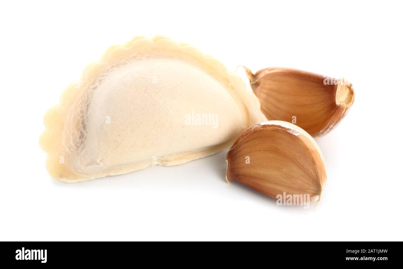 Raw dumpling with garlic on white background Stock Photo - Alamy