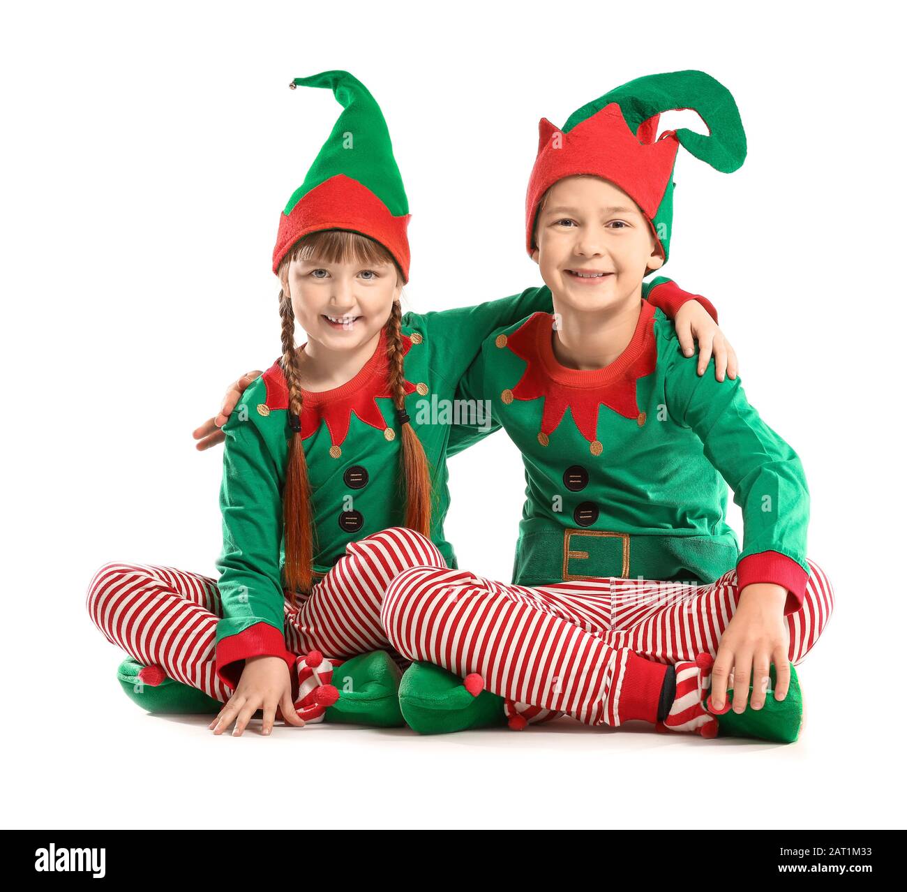 Little children in costume of elf on white background Stock Photo - Alamy
