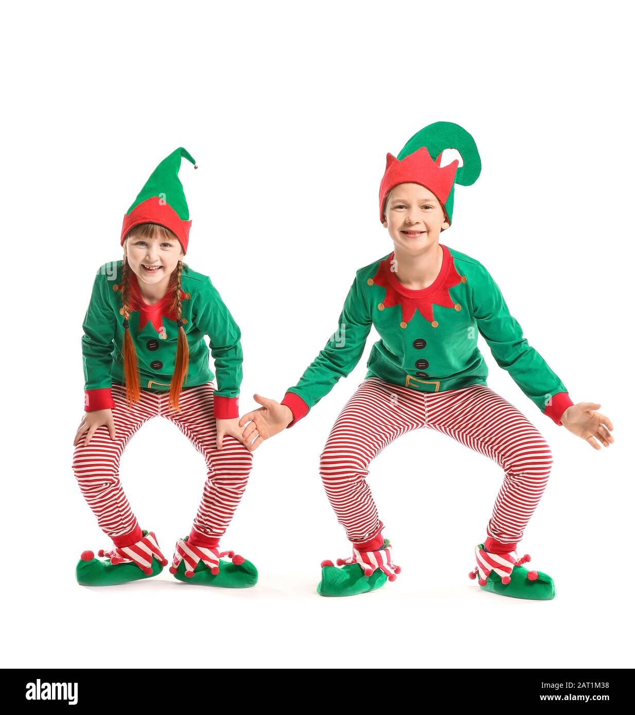 Little children in costume of elf on white background Stock Photo - Alamy