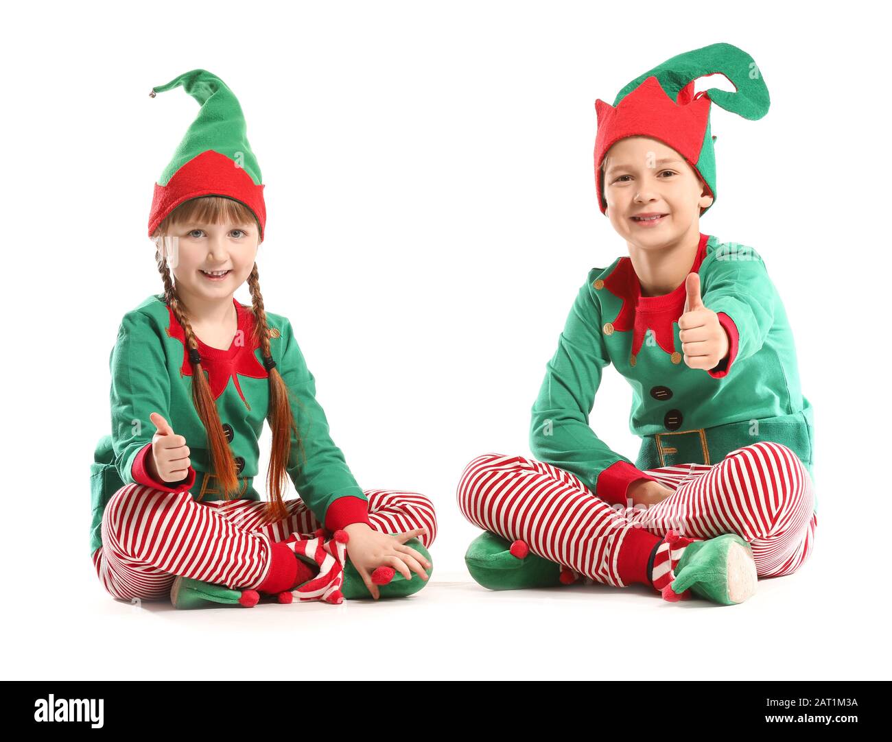 Little children in costume of elf showing thumb-up gesture on white ...