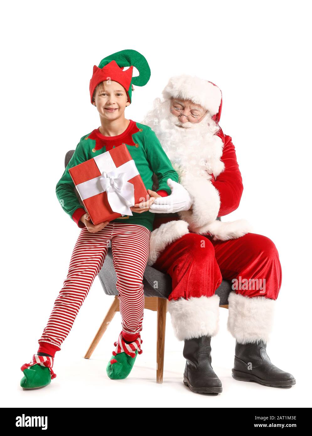 Santa Claus and little elf kid with gift on white background Stock ...