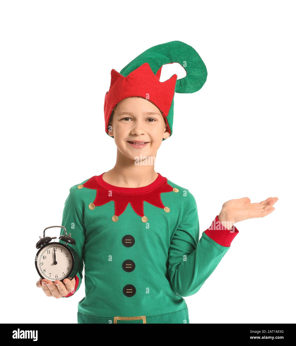 Little boy in costume of elf and with alarm clock on white background ...