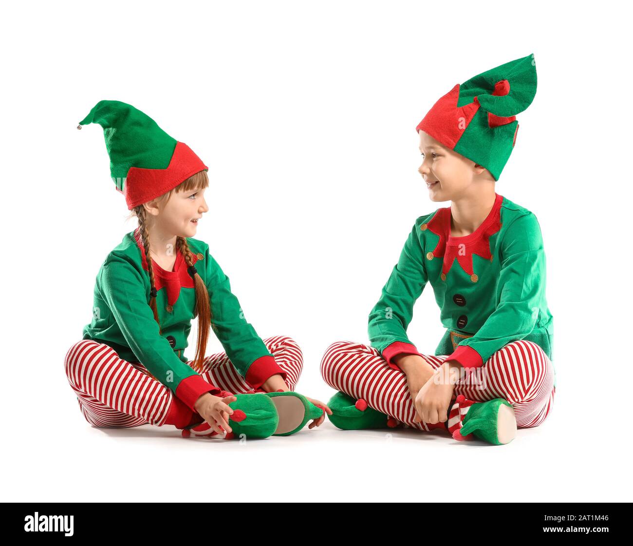 Little children in costume of elf on white background Stock Photo - Alamy