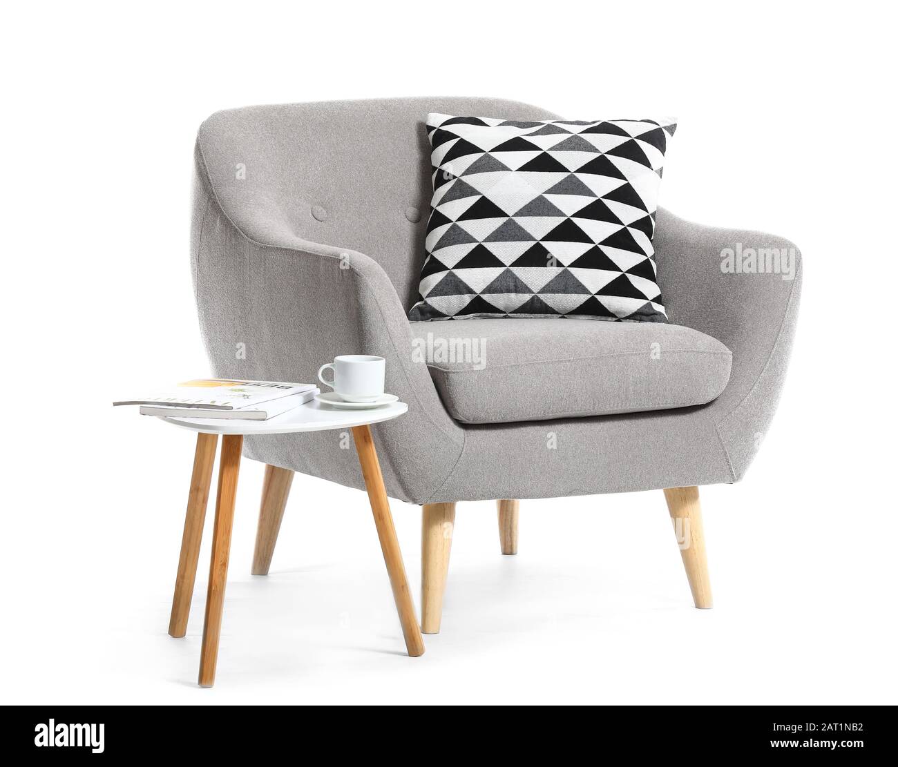 Modern armchair and table on white background Stock Photo - Alamy