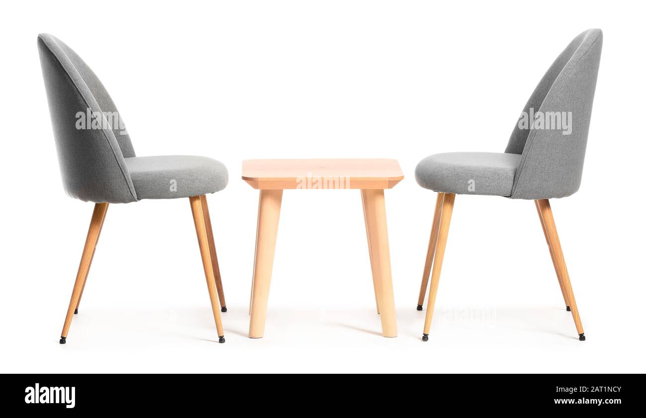 Modern chairs and table on white background Stock Photo - Alamy