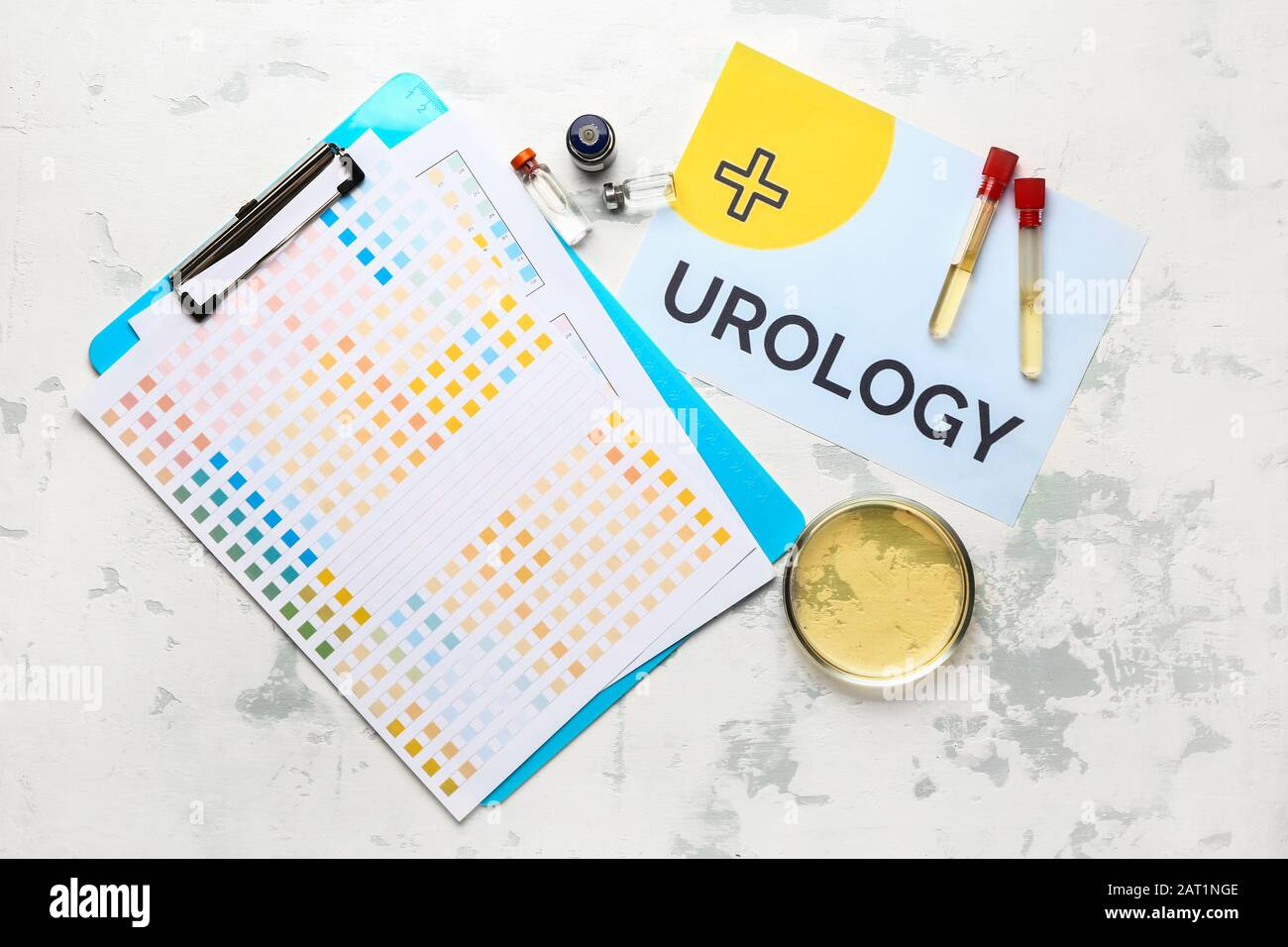 Paper sheet with text UROLOGY, Petri dish and medicines on light ...