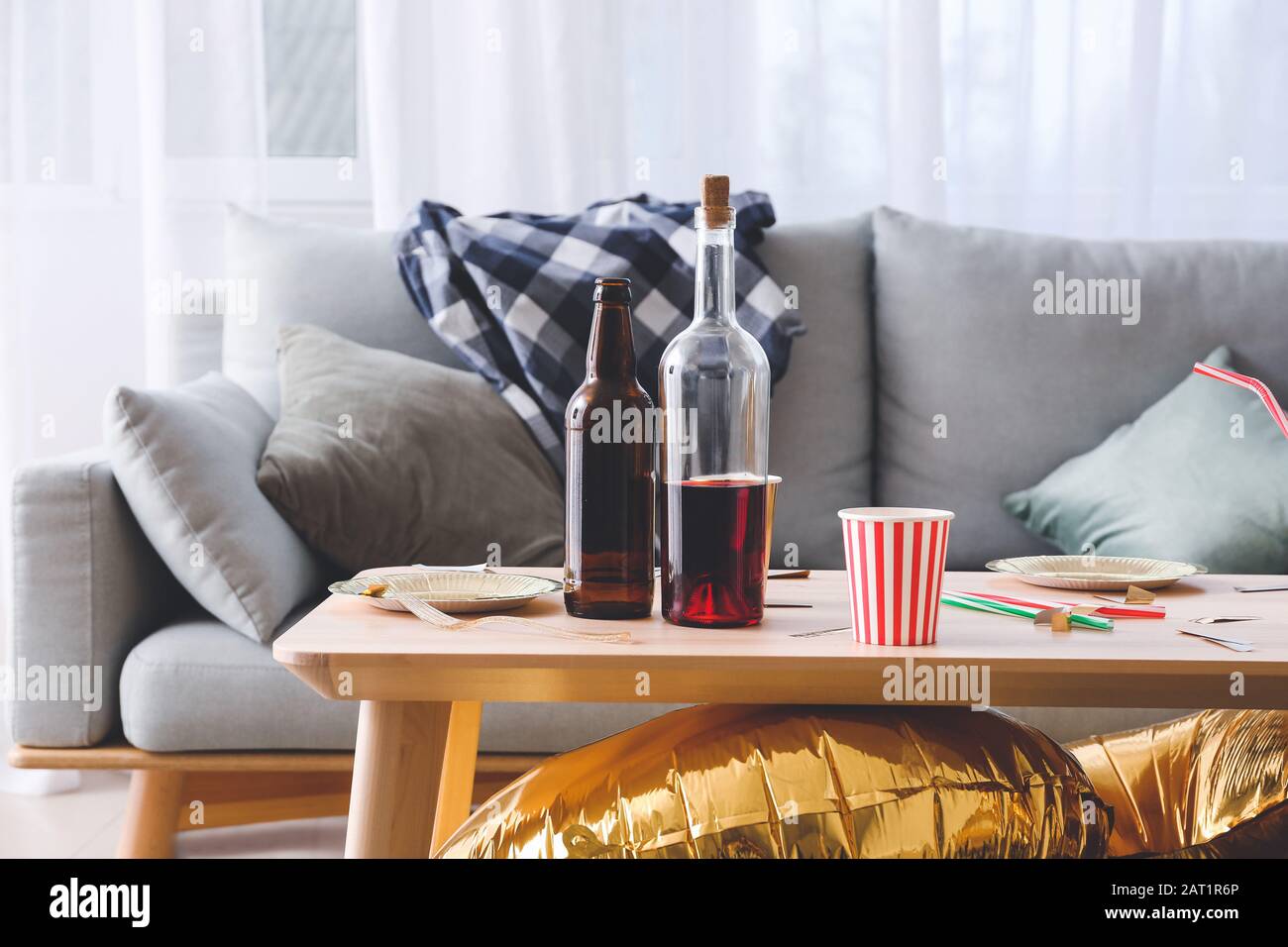 Table with terrible mess in room after New Year party Stock Photo - Alamy