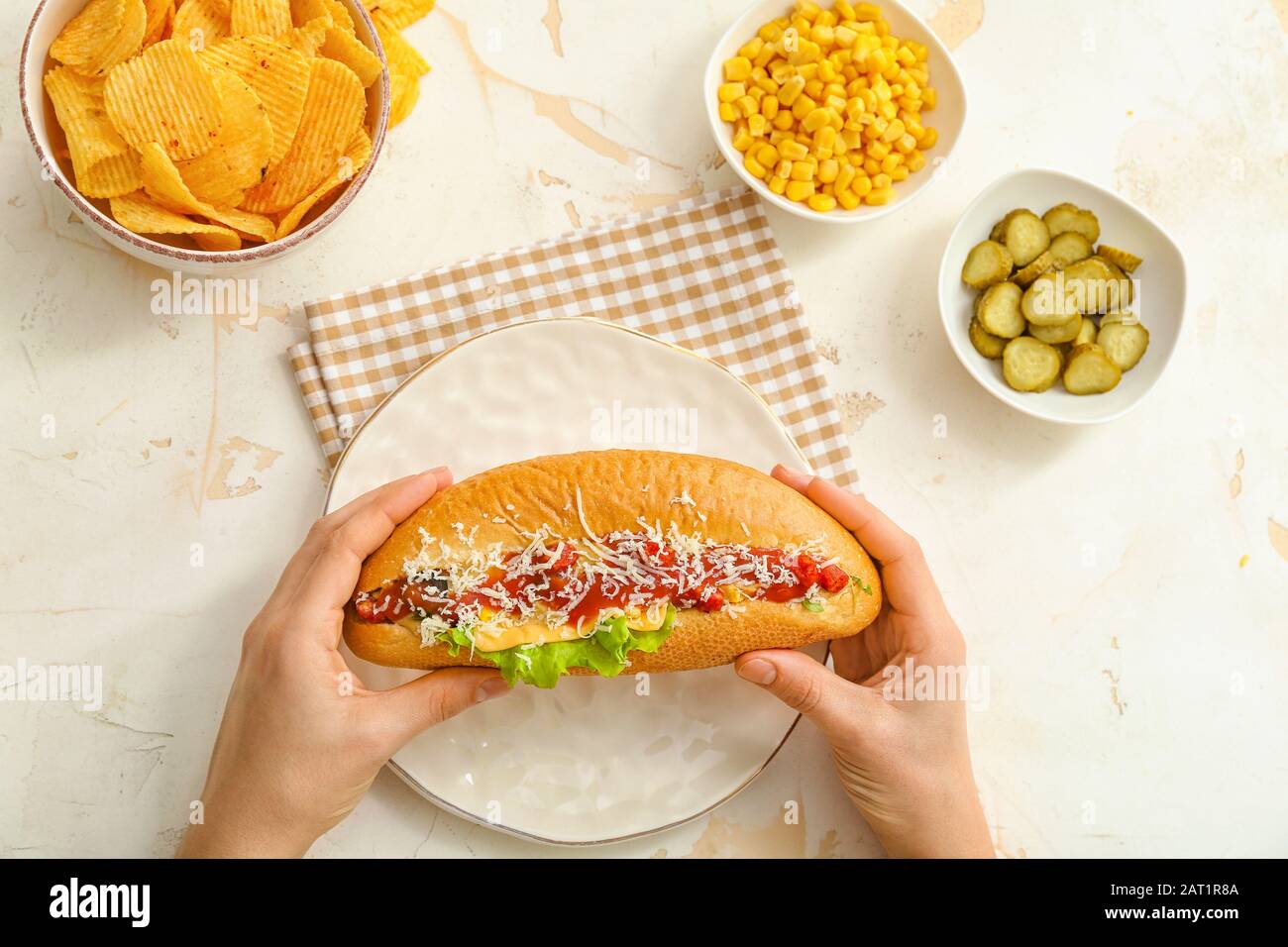 Woman eating corn dog hi-res stock photography and images - Alamy