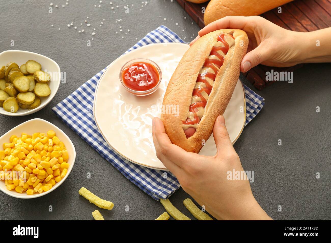 Woman eating corn dog hi-res stock photography and images - Alamy