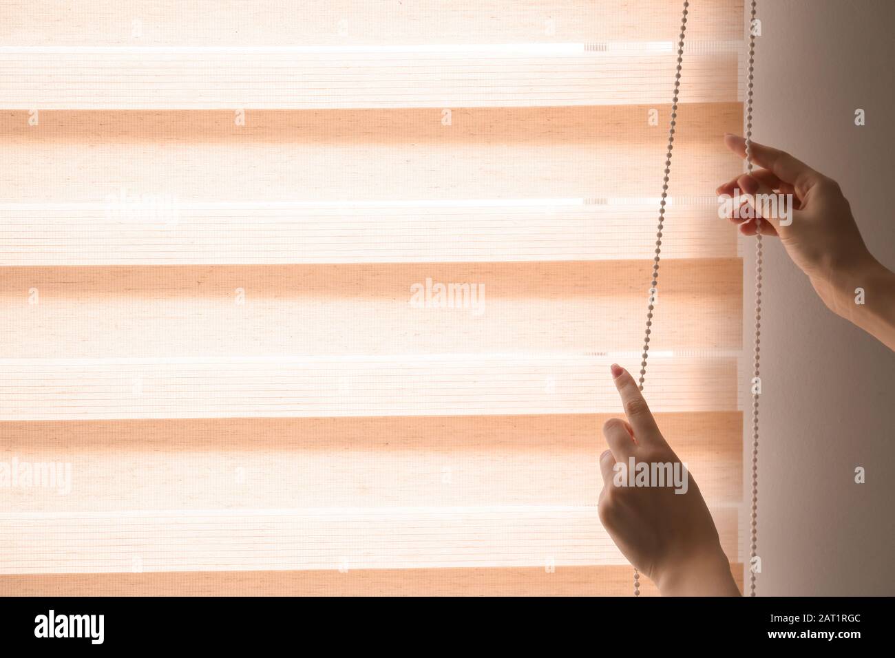 Hand closing window shade hi-res stock photography and images - Alamy